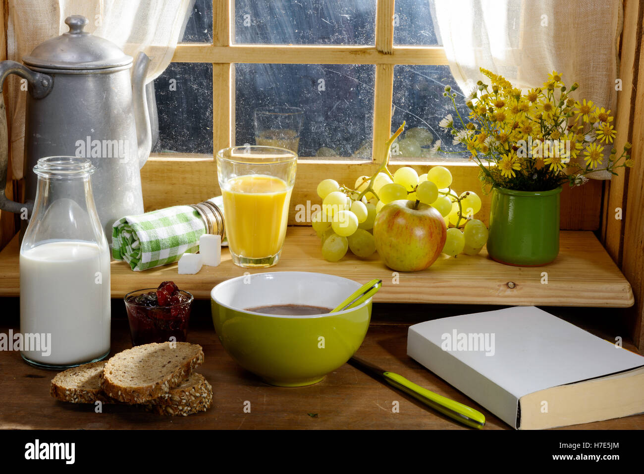 Breakfast with milk, bread, apple and grape Stock Photo - Alamy