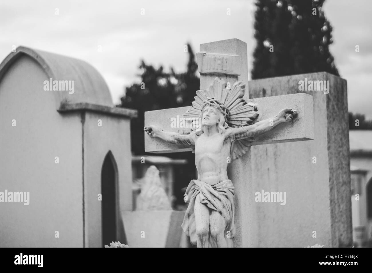 Photograph of a stone crucifix statue Stock Photo - Alamy