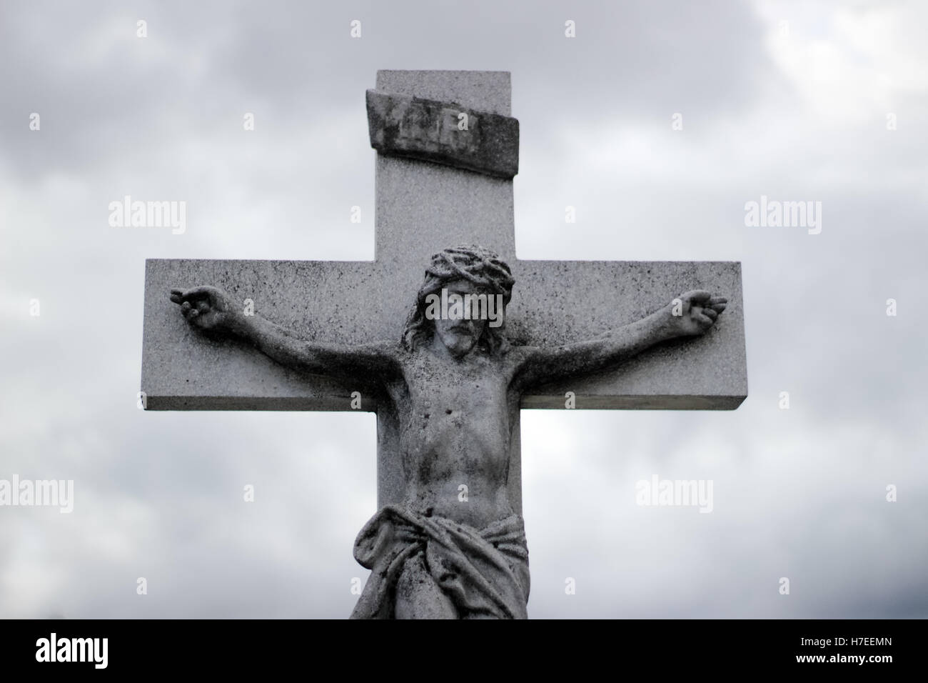 Photograph of a stone crucifix statue Stock Photo - Alamy