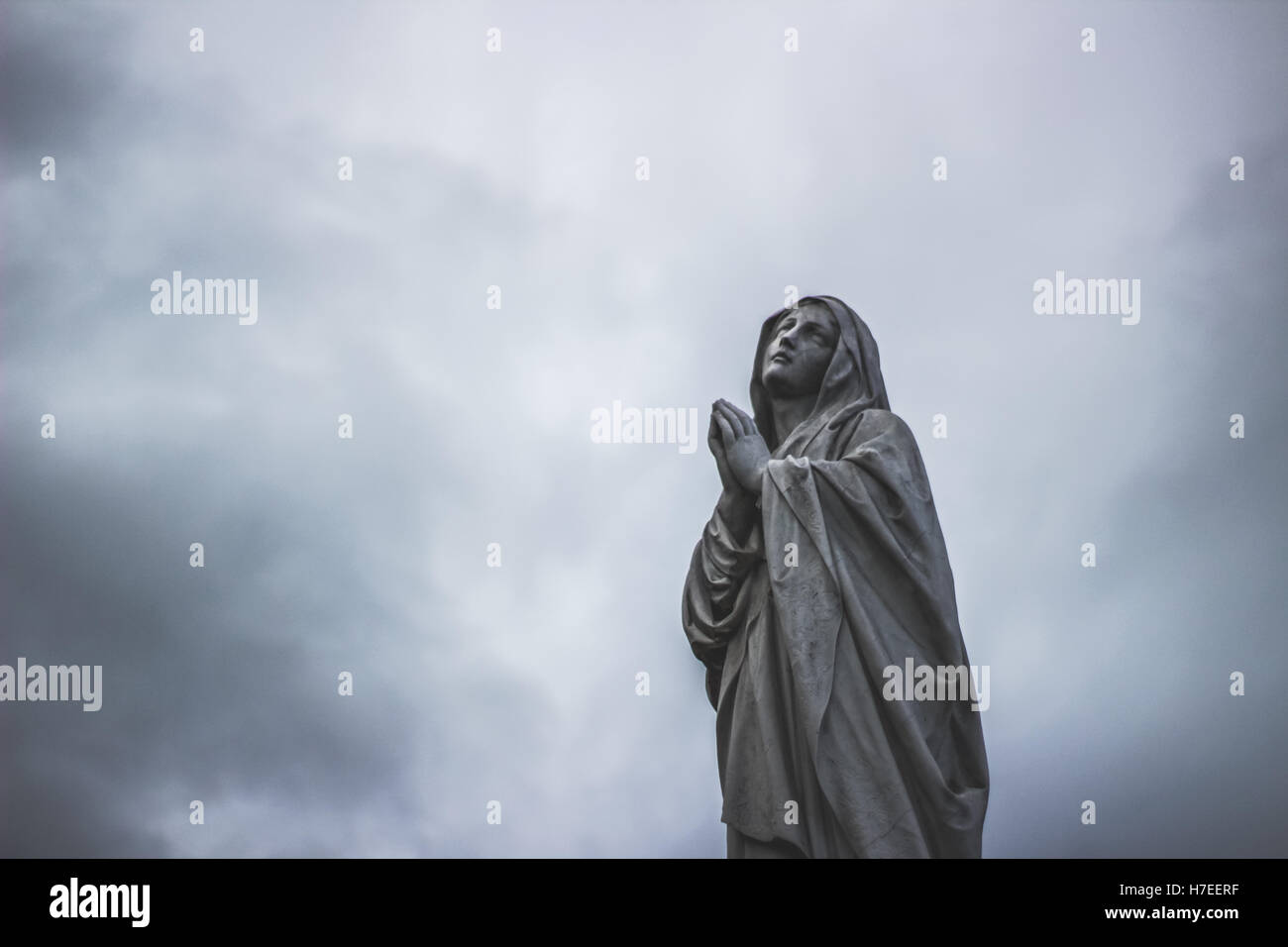 Photograph of a Virgin Mary stone statue Stock Photo - Alamy
