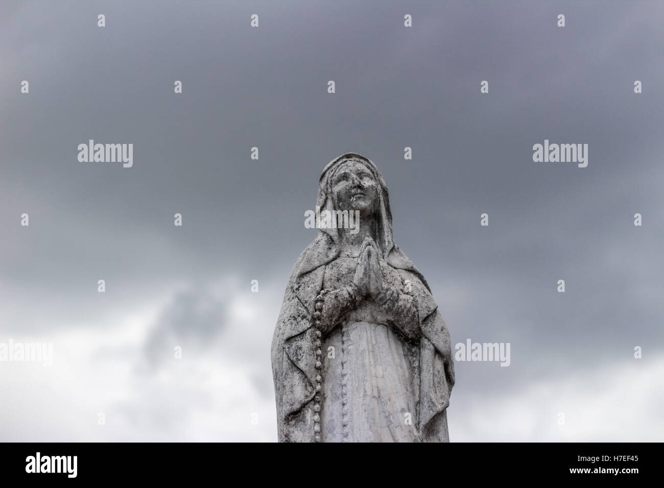 Photograph of a Virgin Mary stone statue Stock Photo - Alamy