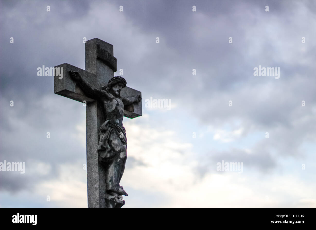 Photograph of a stone sculpted Crucifix Stock Photo - Alamy