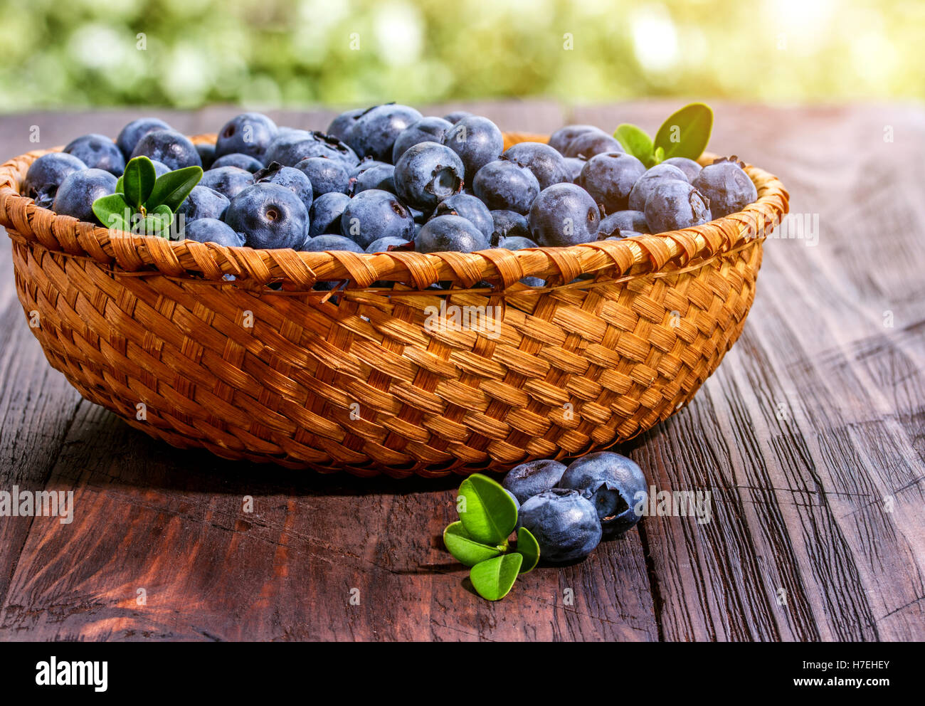 Blueberries on a old wooden table outdoors Stock Photo - Alamy