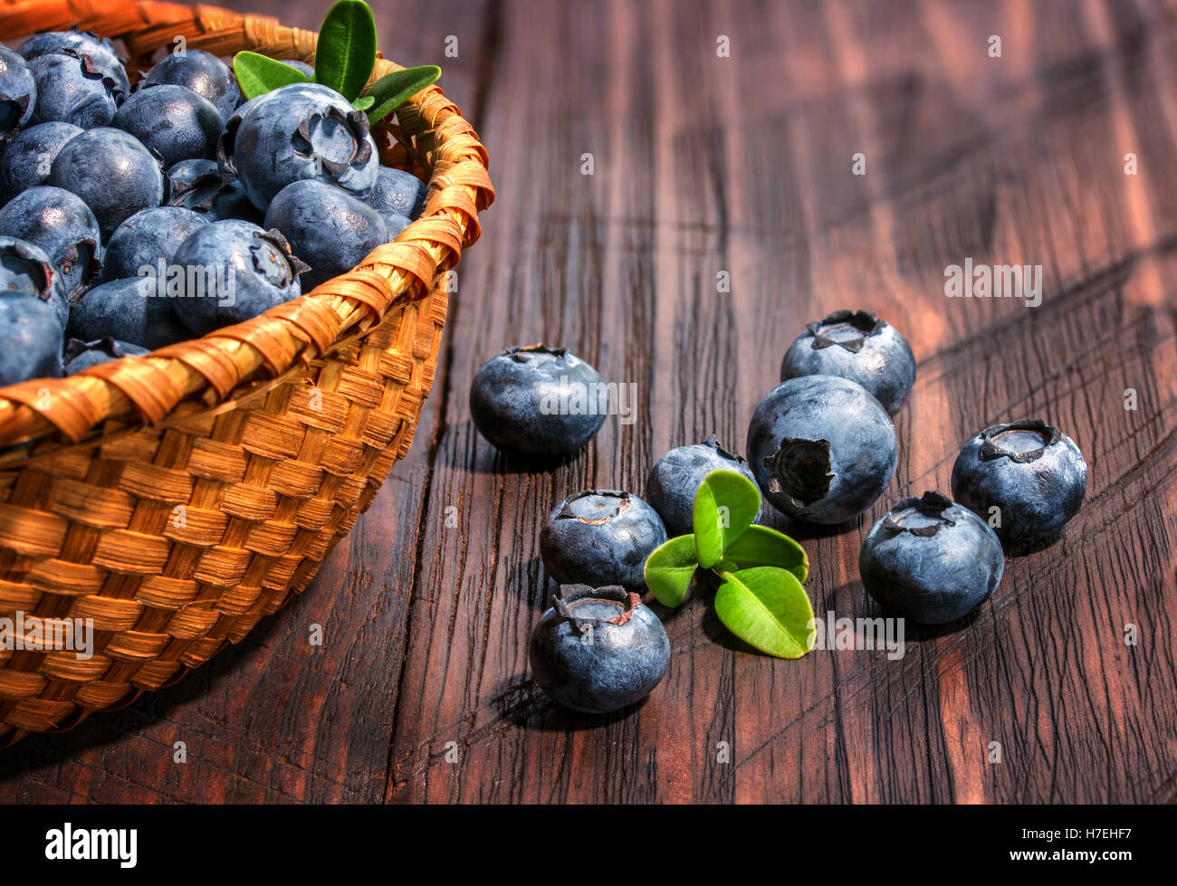 Blueberries on a old wooden table outdoors Stock Photo - Alamy