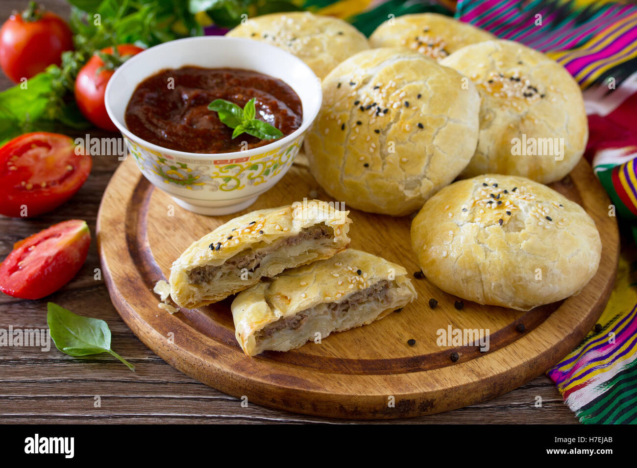 Pies fried samosa on a wooden table, the national dish of Caucasian ...