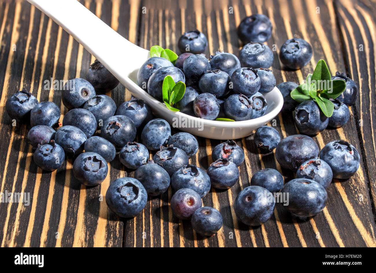 Blueberry on wooden table background. Ripe and juicy fresh picked ...