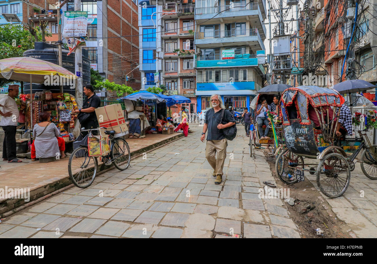 Pedestrian and vendors in the city of Kathmandu Nepal going about their ...