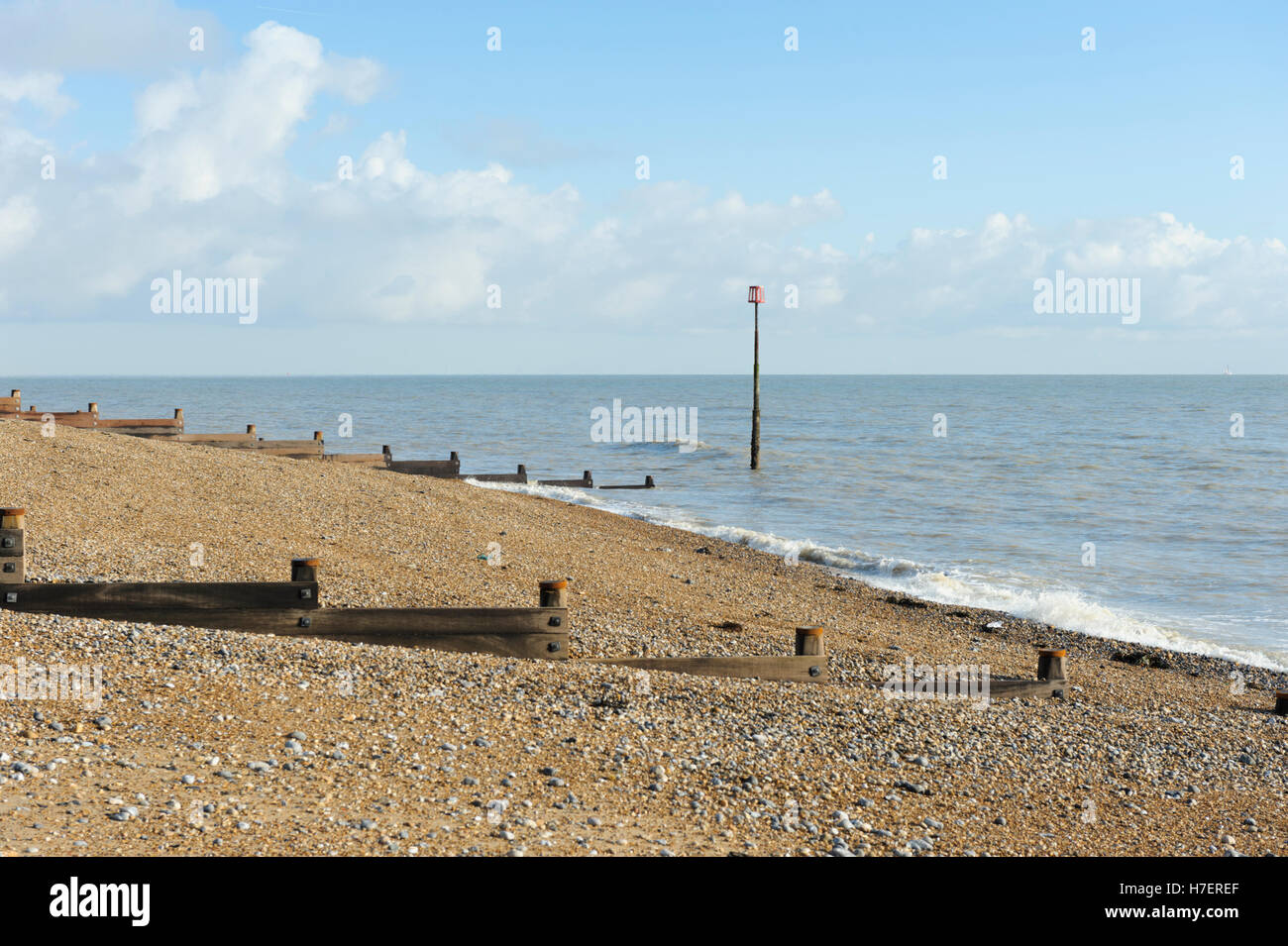 Shingle beach, marker post and groynes at Kingsdown, Kent Stock Photo ...