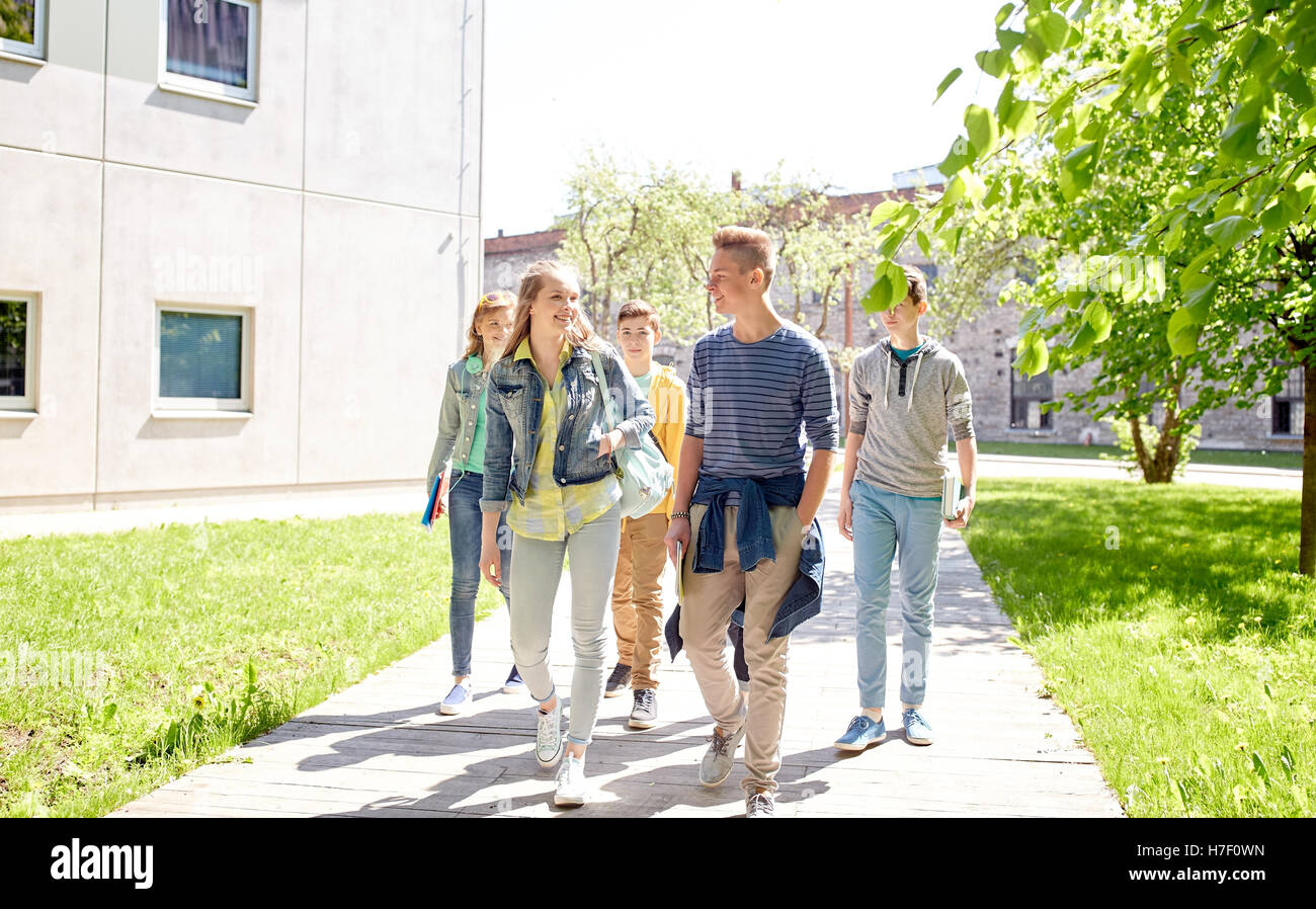 group of happy teenage students walking outdoors Stock Photo - Alamy