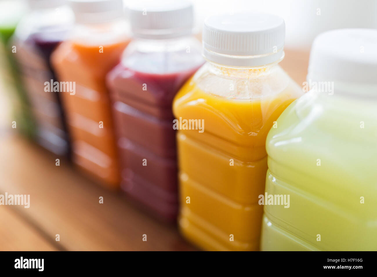 bottles with different fruit or vegetable juices Stock Photo - Alamy