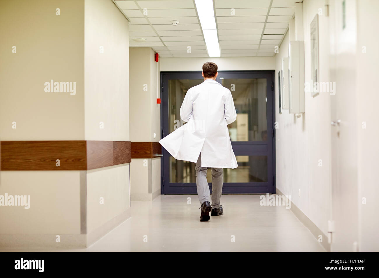medic or doctor walking along hospital corridor Stock Photo - Alamy
