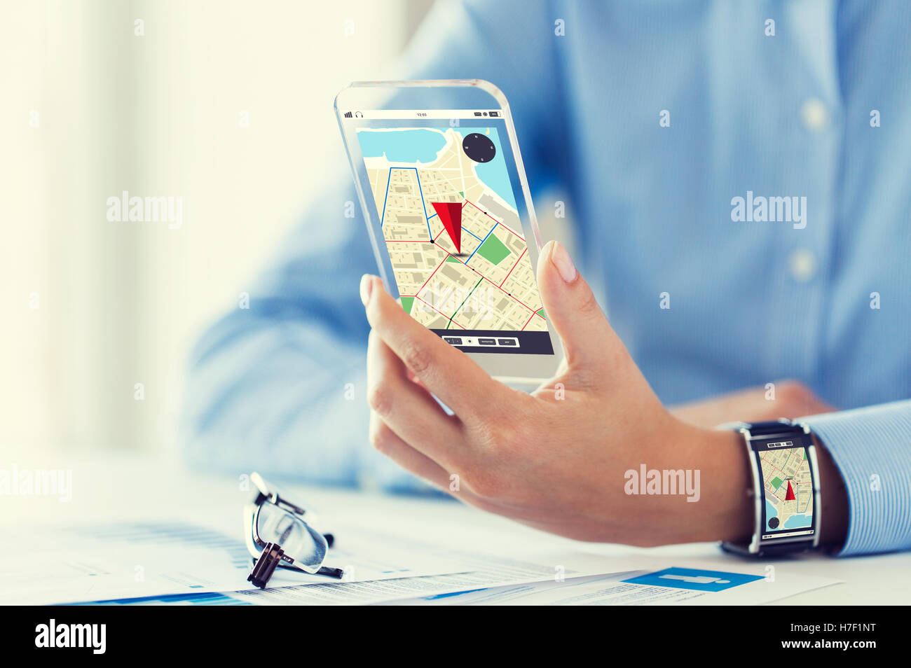hand with navigator map on smart phone and watch Stock Photo - Alamy