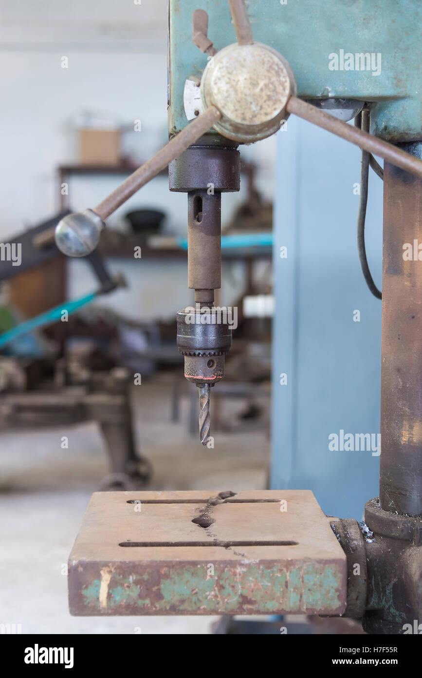 Industrial iron drill in factory, drill press in a mechanical workshop ...