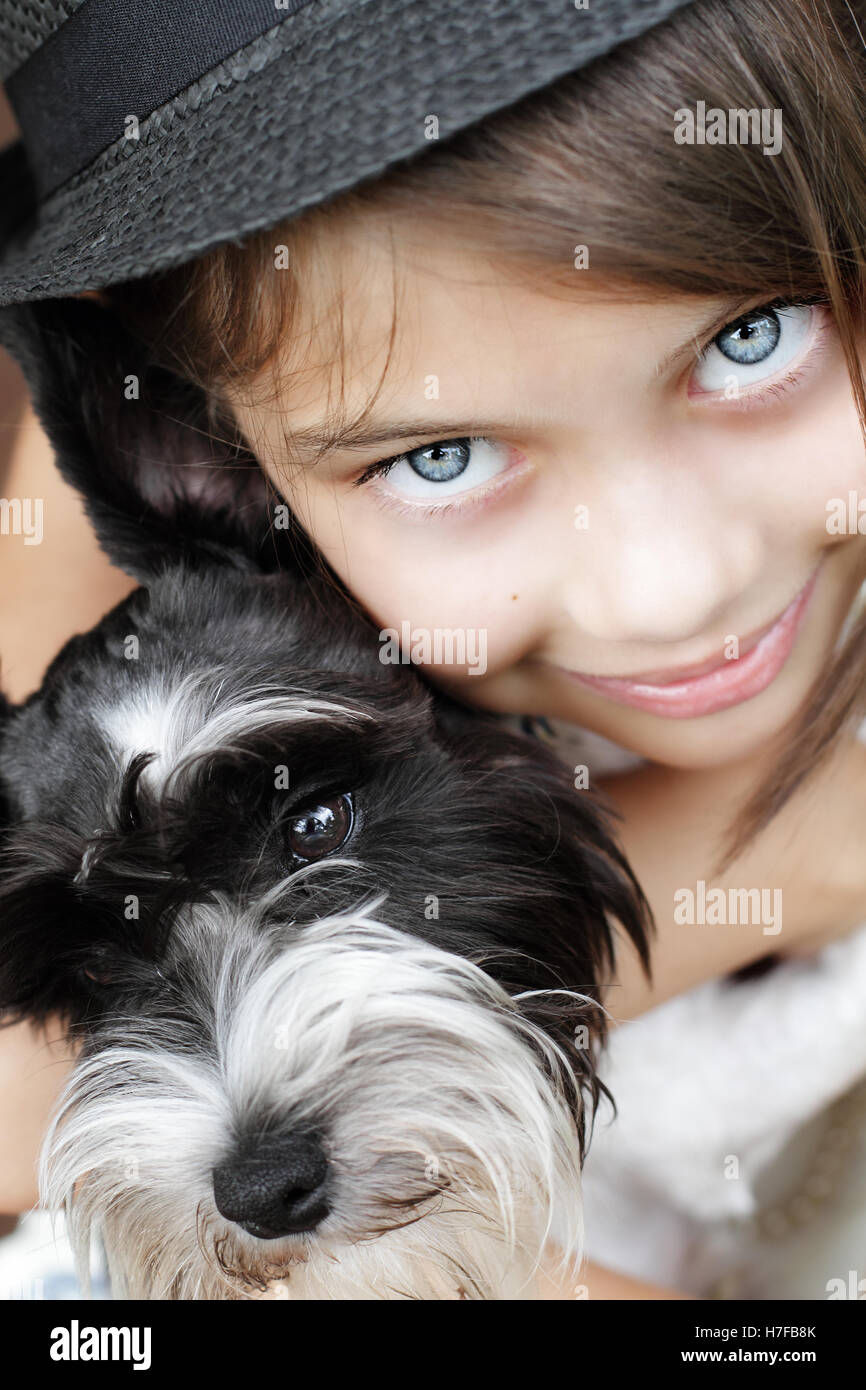 Young girl looking directly into the camera, wearing a fashionable ... Young girl looking directly into the camera, wearing a fashionable ...