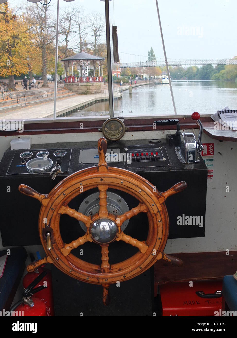 The steering wheel, controls and view from the bridge of a passenger ...
