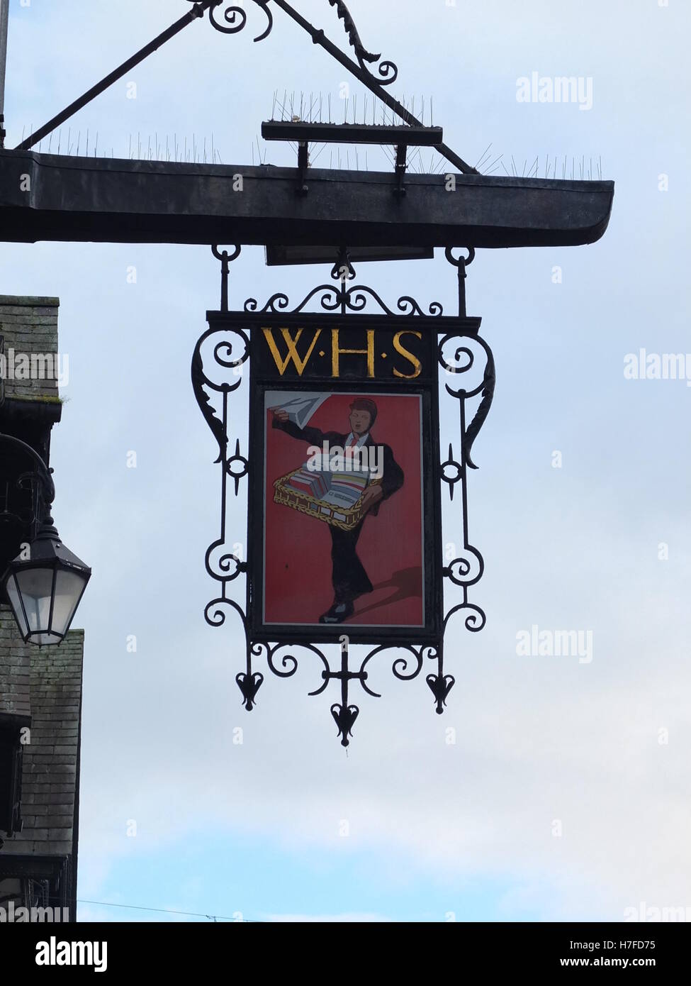 An old sign for 'W.H.S.' (W. H. Smith), the chain newsagents ...
