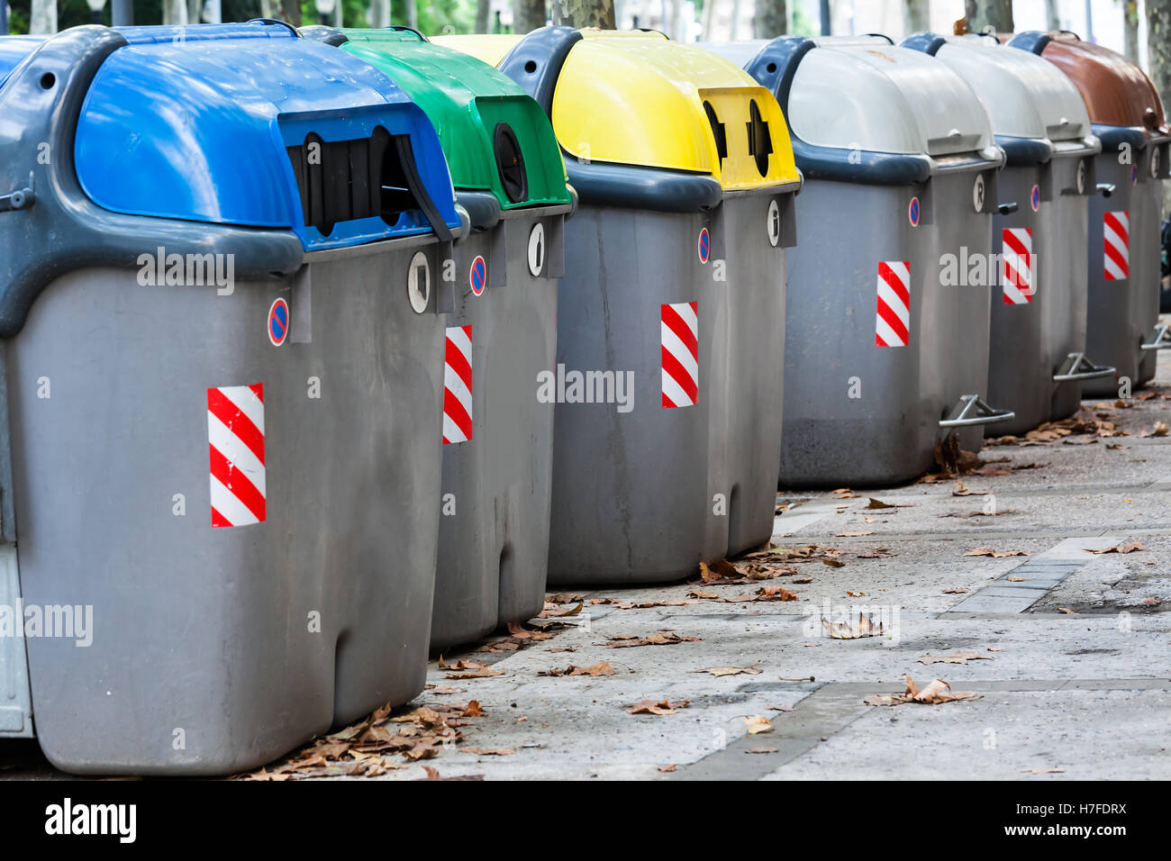 garbage can on a city street Stock Photo - Alamy