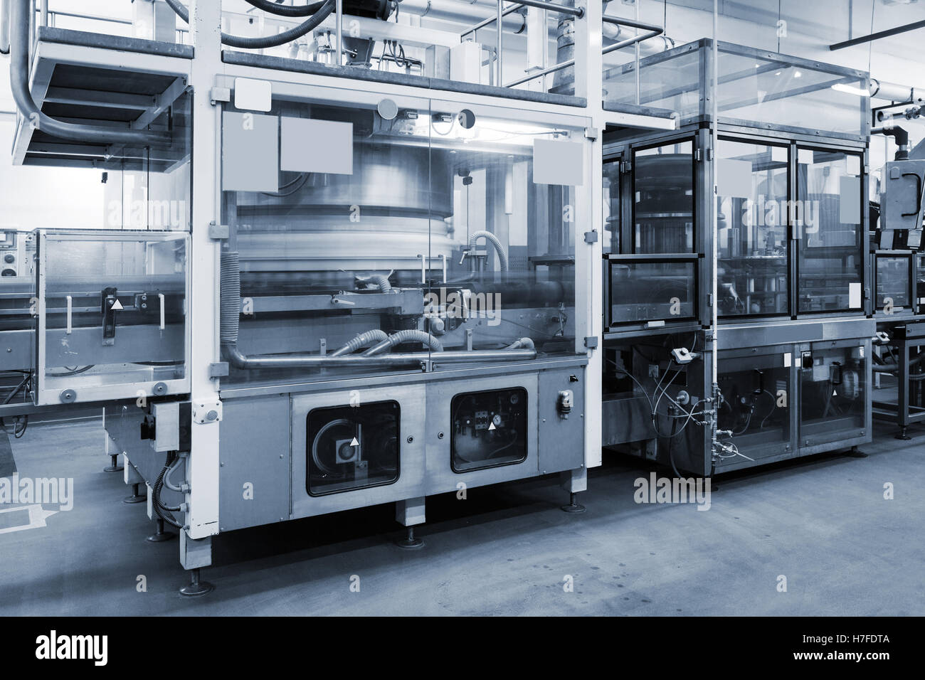 conveyor working at a modern factory Stock Photo - Alamy