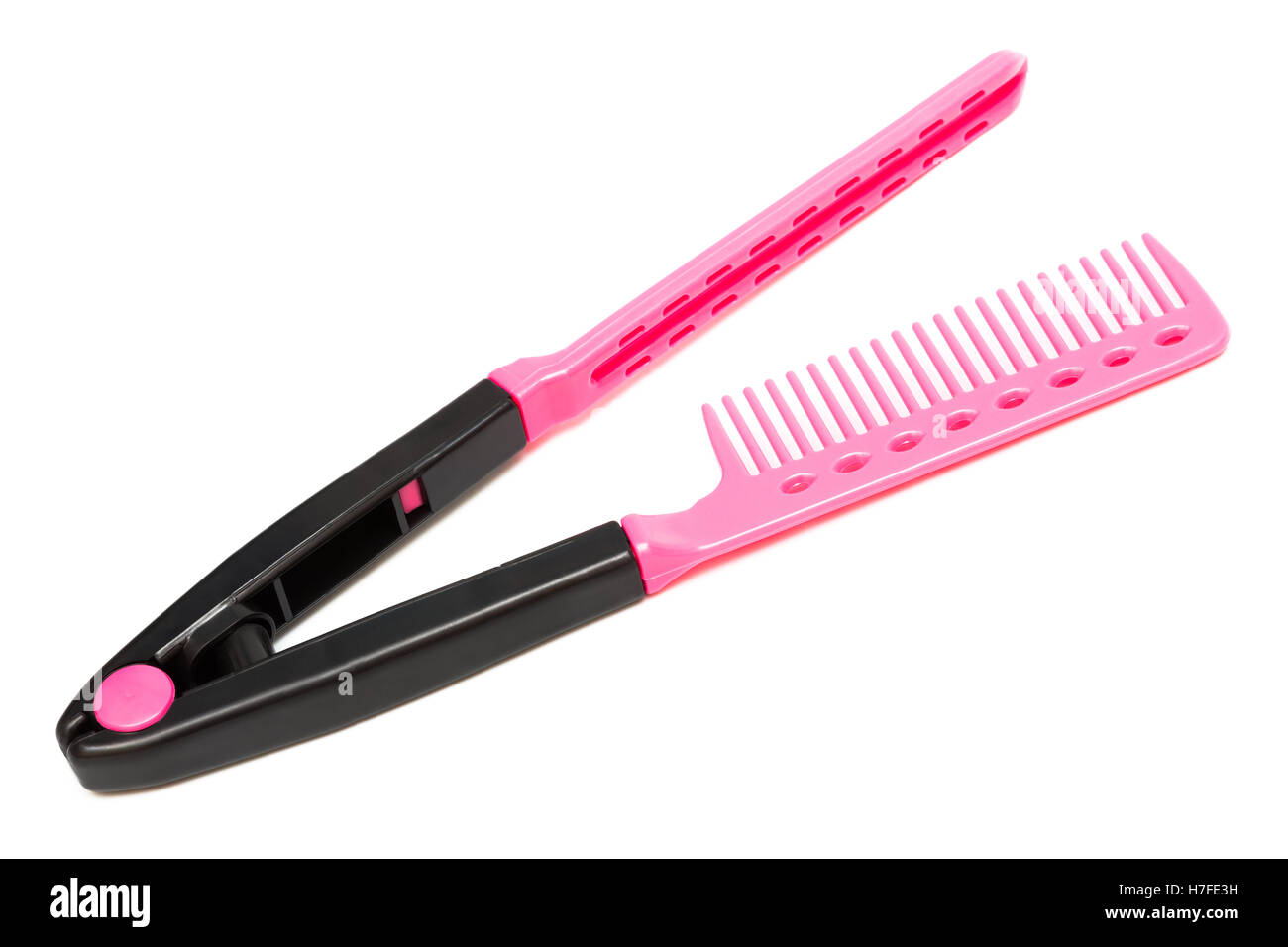 pink comb for styling hair on a white background Stock Photo - Alamy
