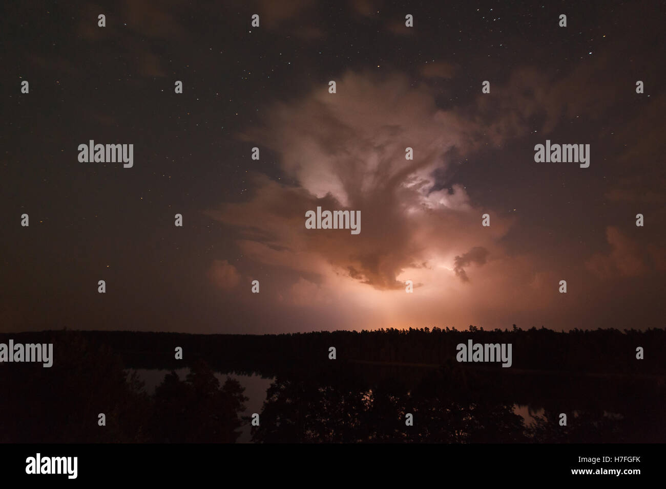 Storm at night, starry sky Stock Photo - Alamy