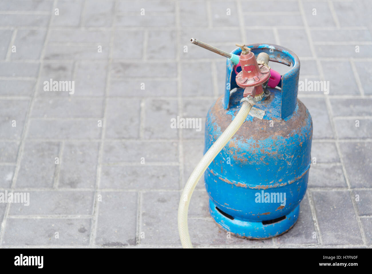 Gas tank cylinder balloon with valve and tube on the ground Stock Photo ...