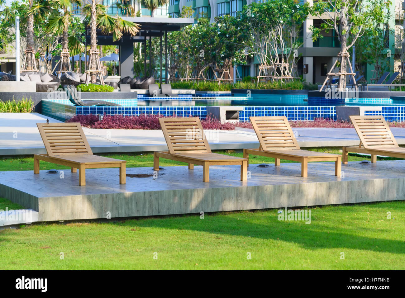 Beach chairs made from weed near swimming pool in garden Stock Photo ...
