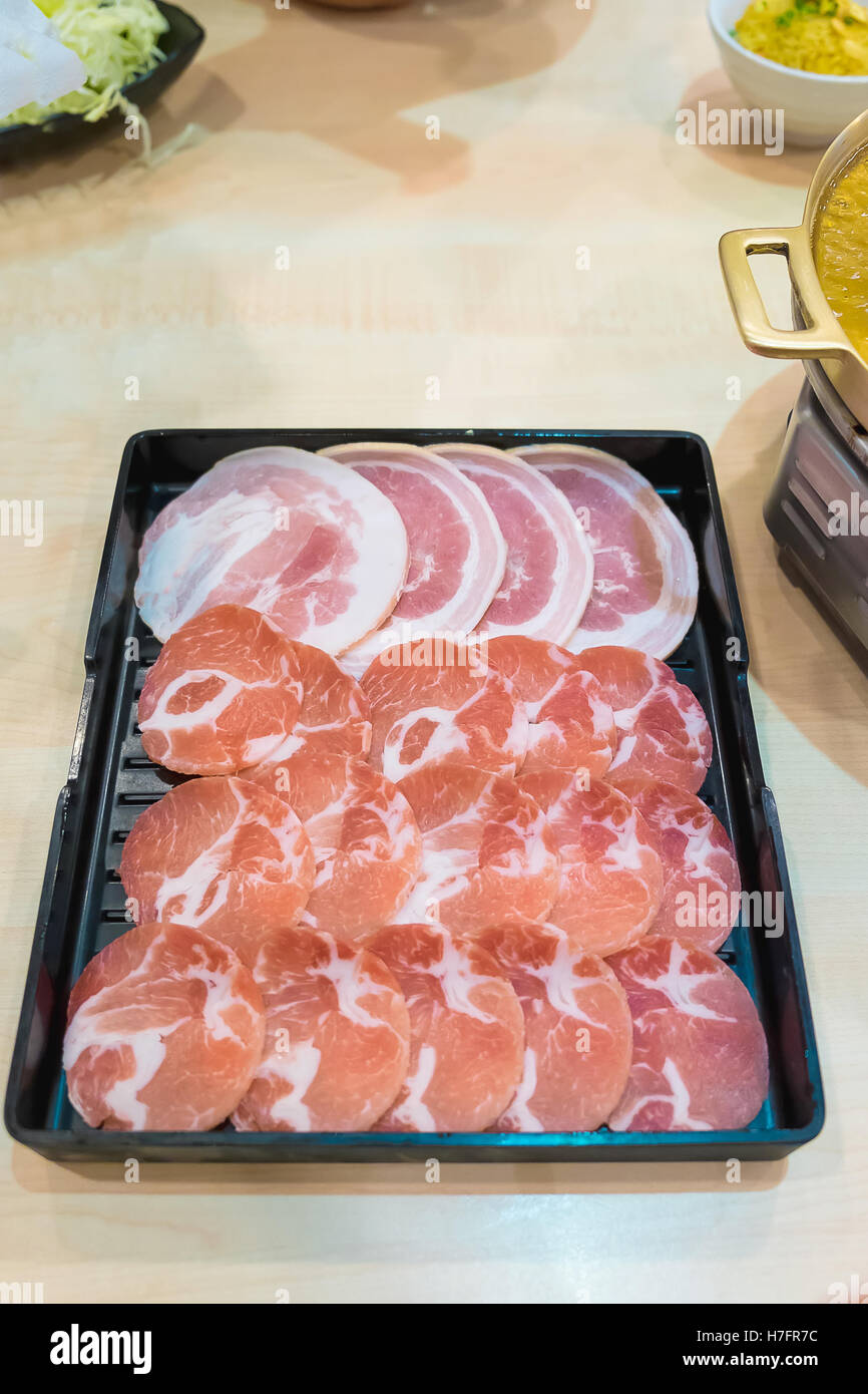 Raw kurobuta pork slices on plates hi-res stock photography and images ...