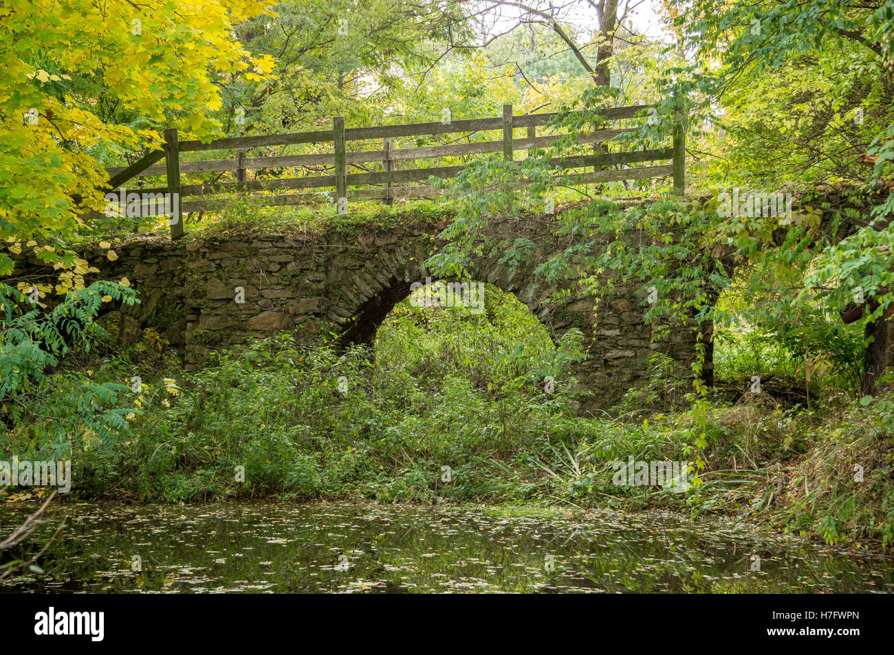 Old stone Bridge over moat Old moated castle in Bagieniec Lower Silesia ...