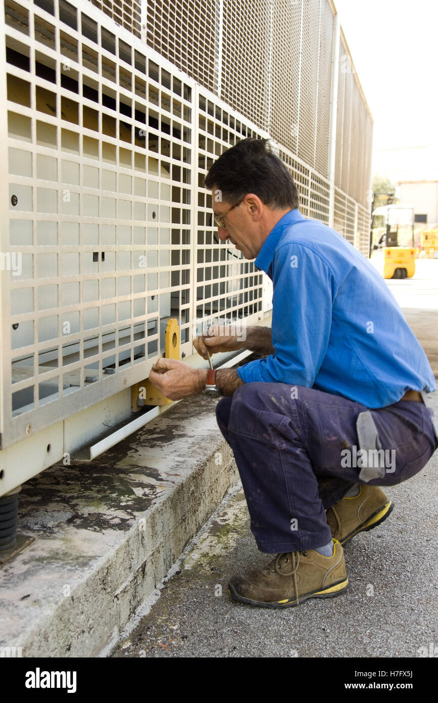 repairing a broken machinery Stock Photo - Alamy