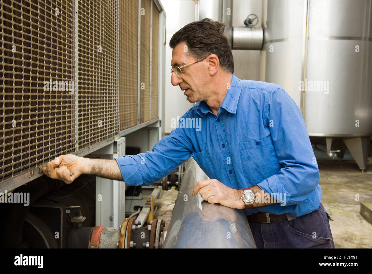 repairing a broken machinery Stock Photo - Alamy
