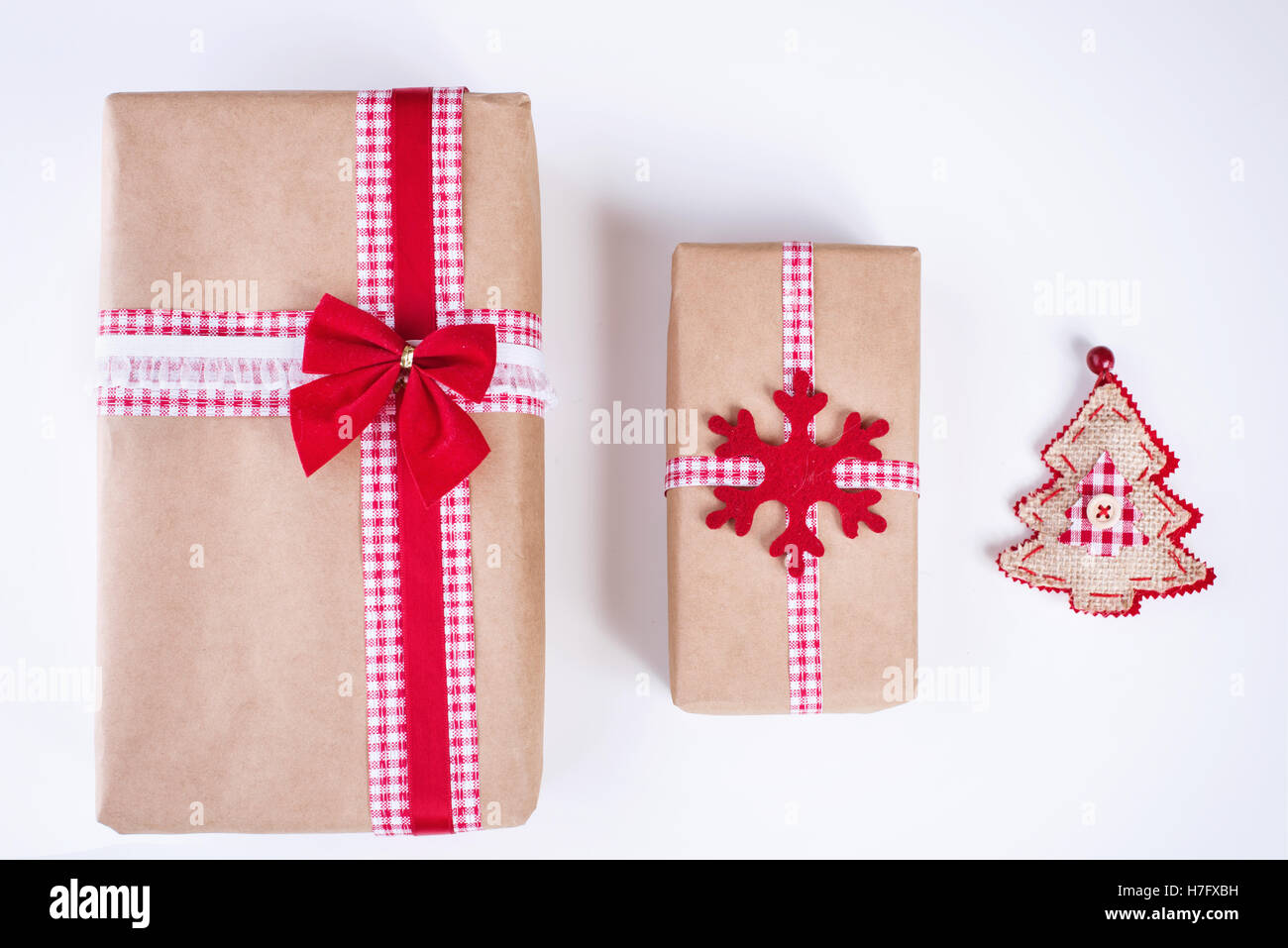 Wrapped vintage gift boxes with red ribbon bow Stock Photo - Alamy