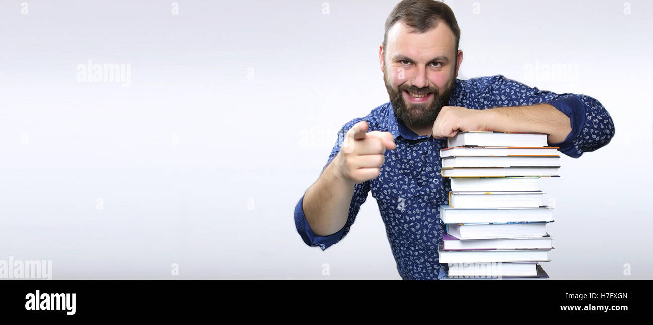 student adult beard man with stack of book Stock Photo - Alamy