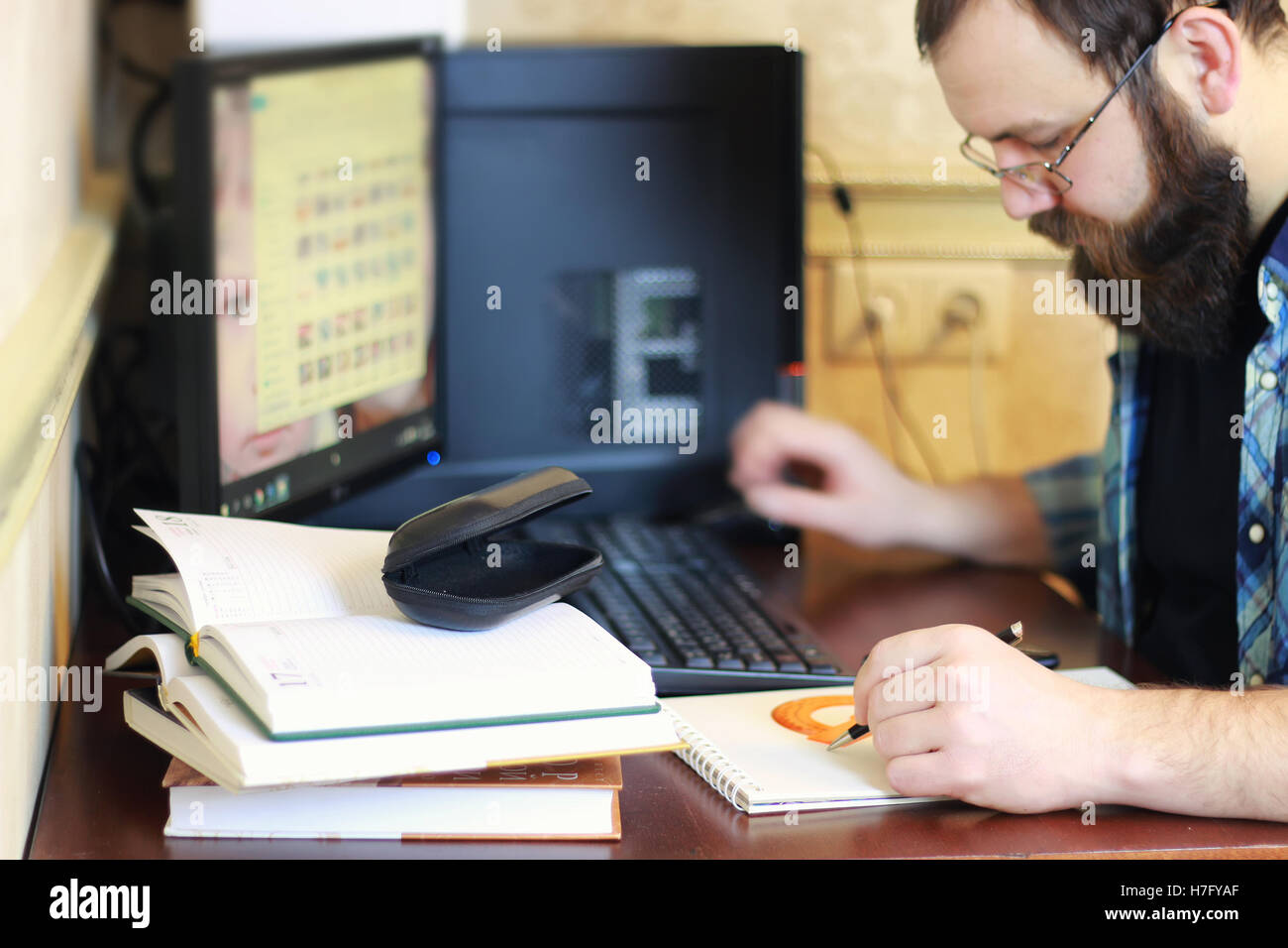 man write pen table Stock Photo - Alamy