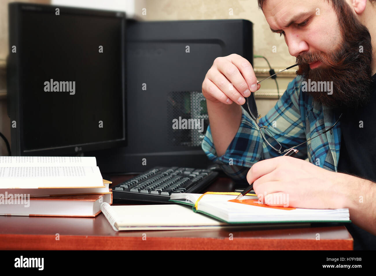 man write pen table Stock Photo - Alamy