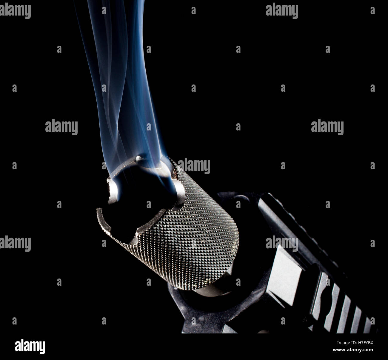 Gun with smoke coming from the barrel on a black background Stock Photo ...