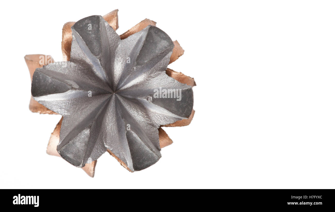 Nine millimeter hollow point bullet that has expanded on a white ...