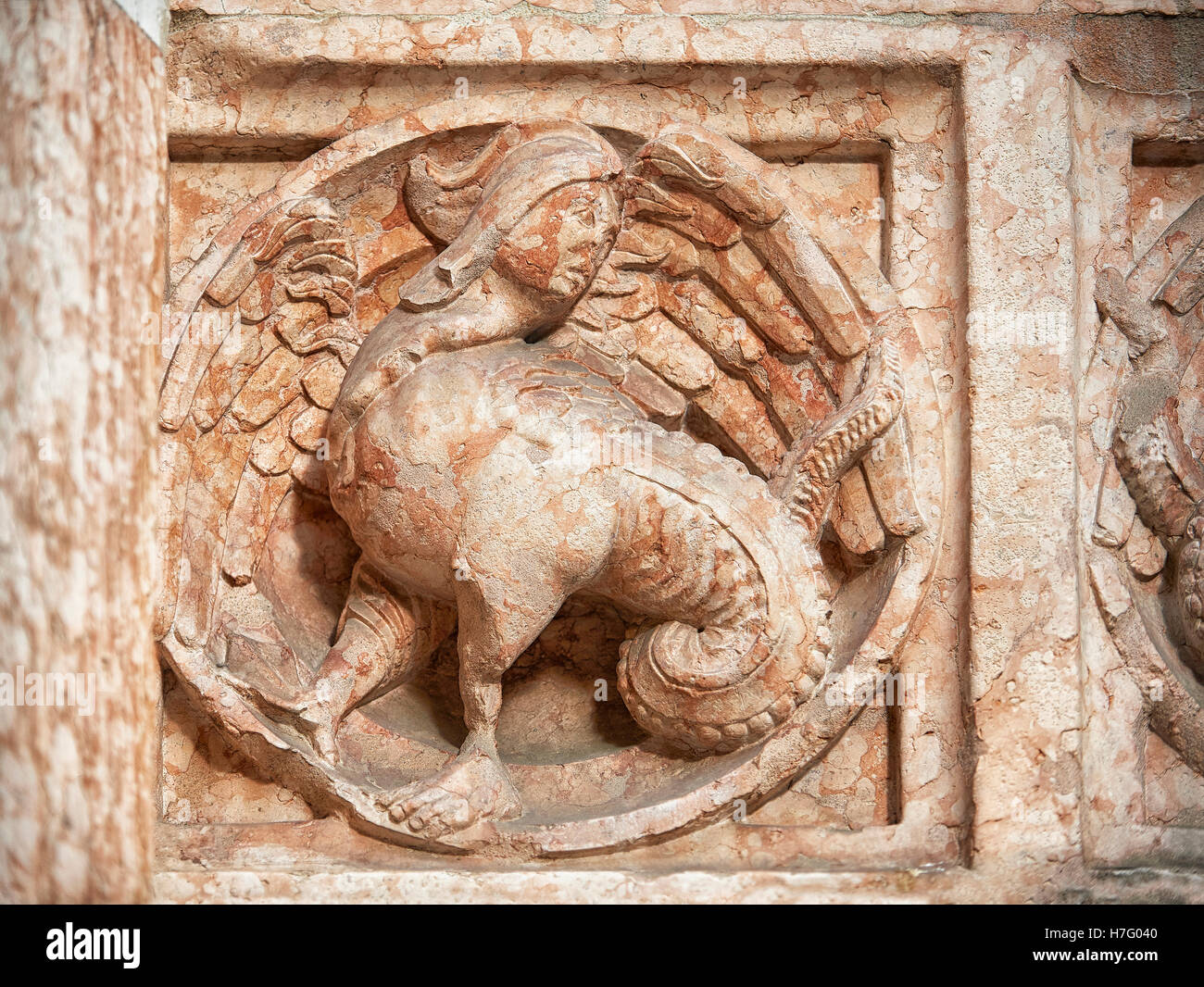 Medieval relief sculptures of mythical half man half dragon creature on ...