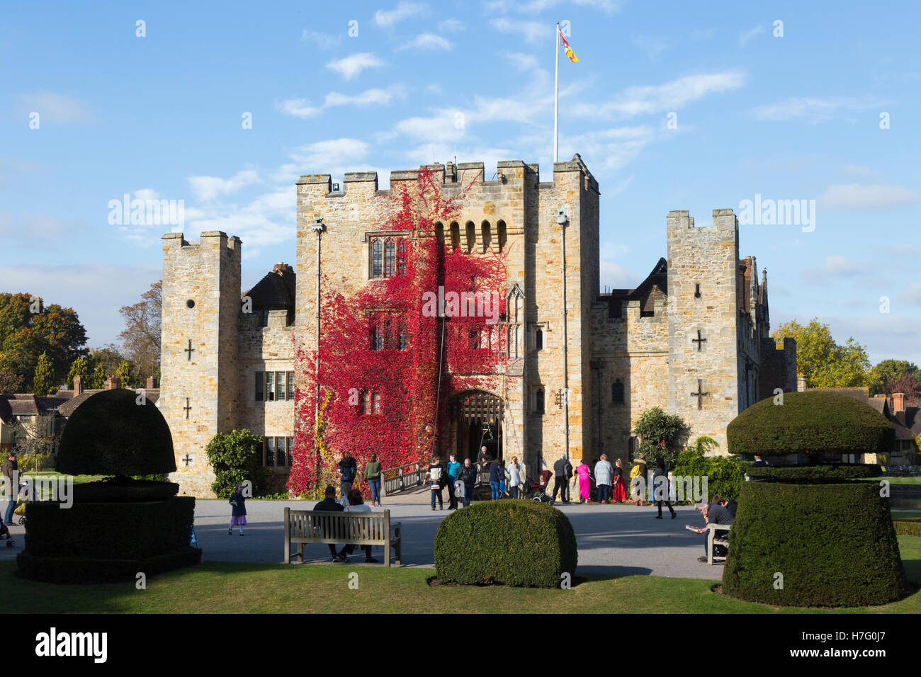 Hever Castle & moat, former home of Anne Boleyn, clad with red autumnal ...