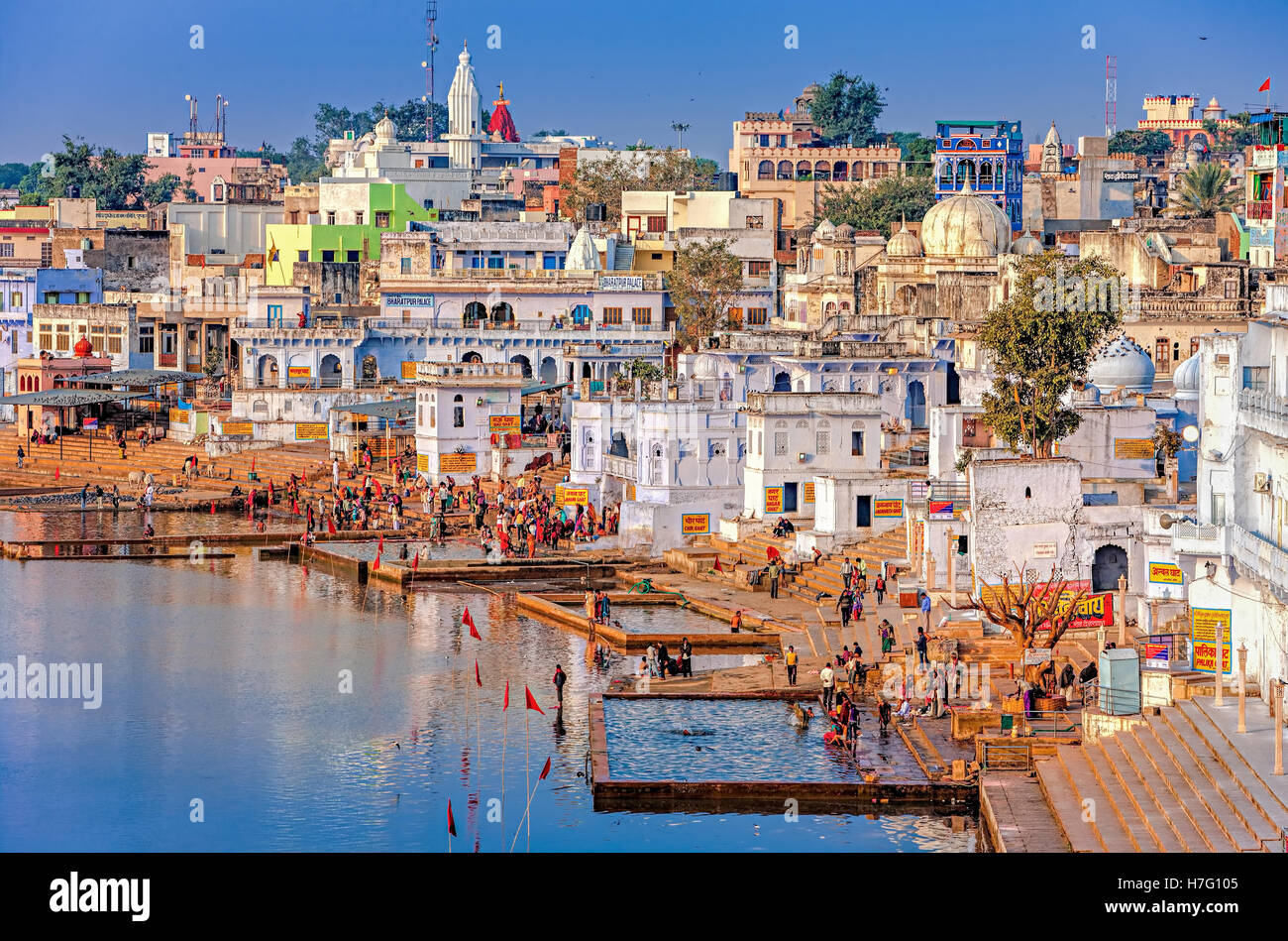 Hindu pilgrims bathing in sacred Lake Pushkar (Sarovar) on ghats ...