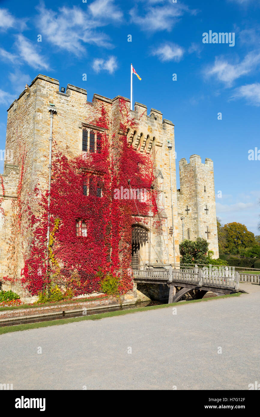 Hever Castle & moat, former home of Anne Boleyn, clad with red autumnal ...