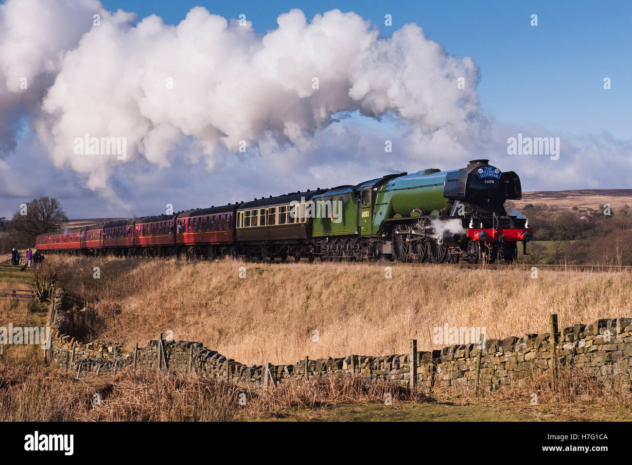 Blue sky & iconic train (steam locomotive, LNER Class A3 60103 Flying Scotsman) travels on ...
