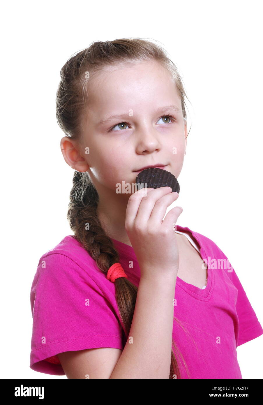 pretty girl eating chocolate bisquit Stock Photo - Alamy