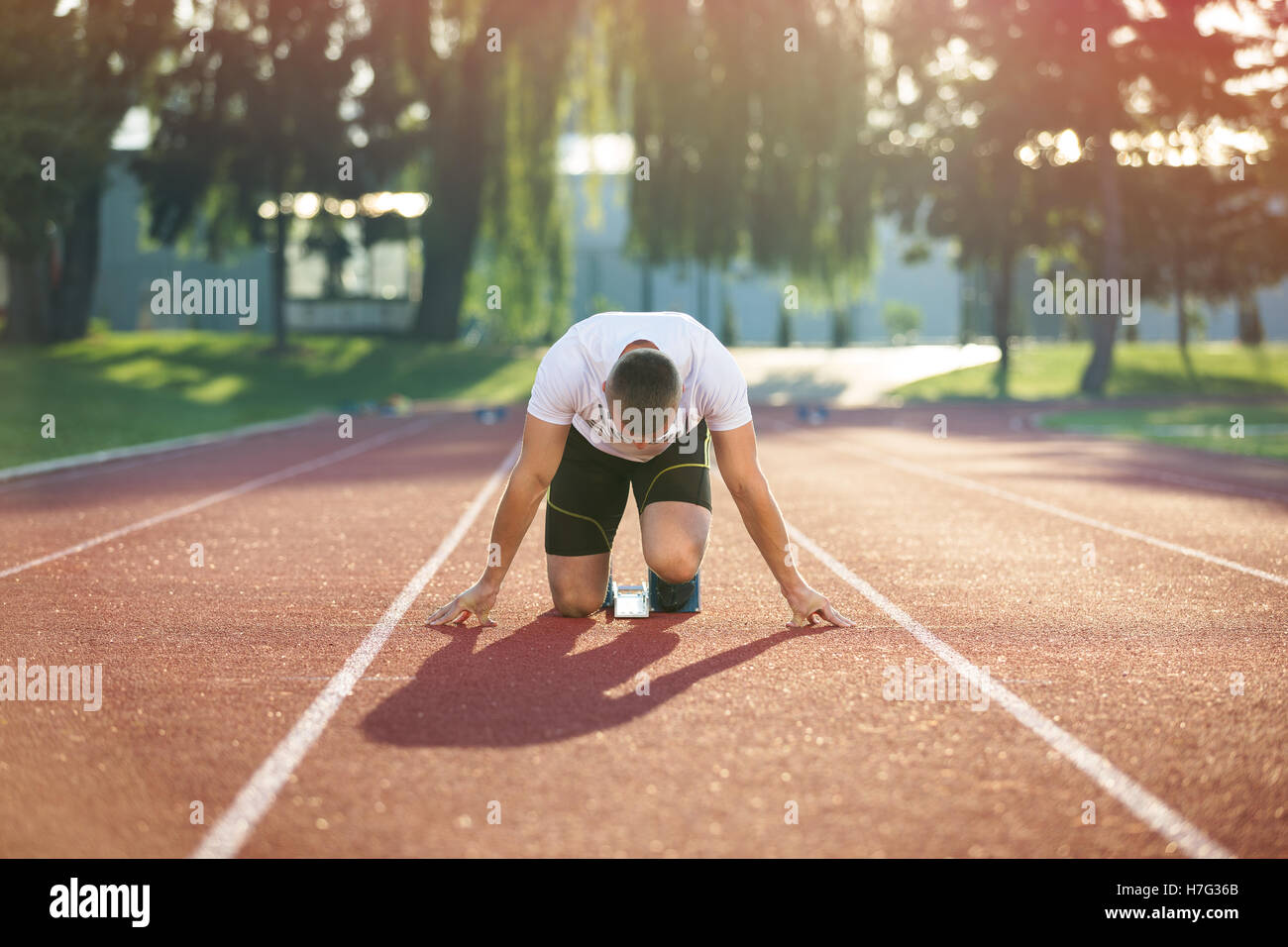 Detailed view of a sprinter getting ready to start. Selective focus ...