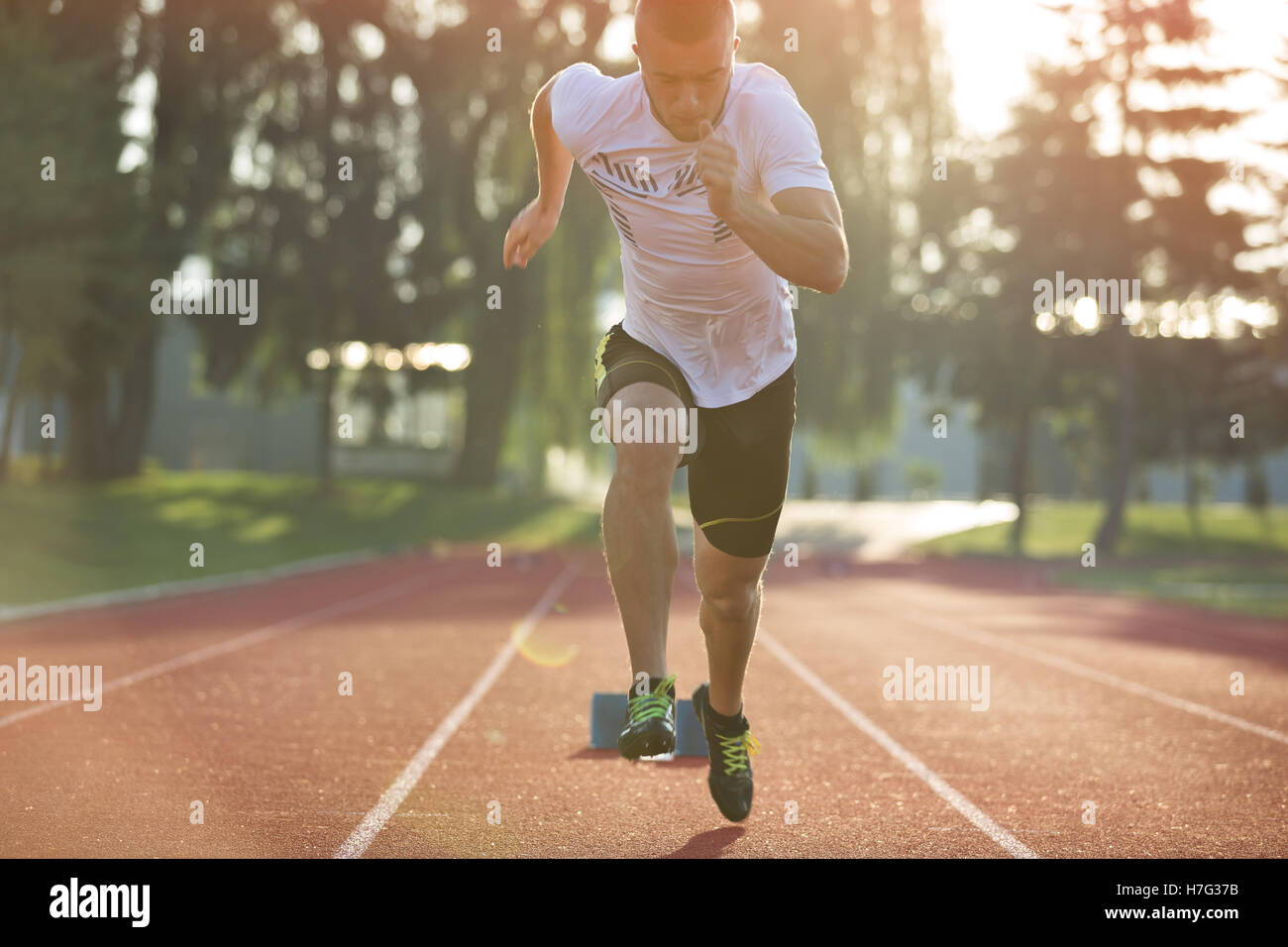 Detailed view of a sprinter getting ready to start. Selective focus ...