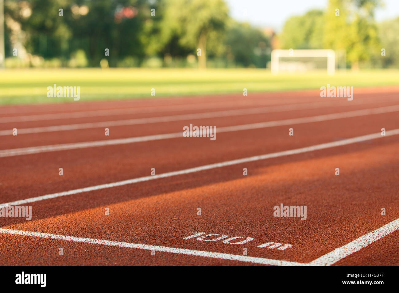 Red race track with numbers on sunny day Stock Photo - Alamy