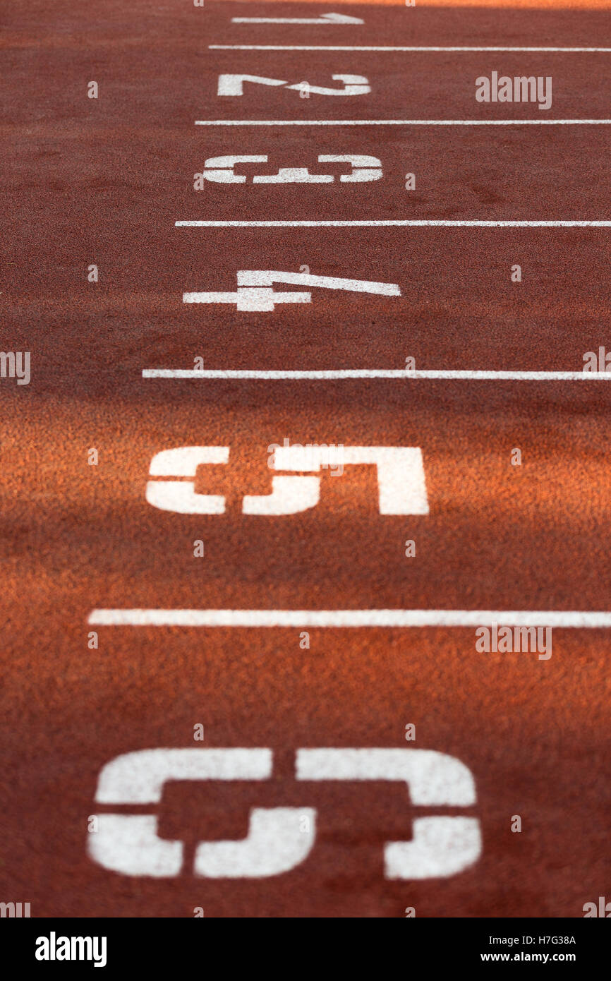 Red race track with numbers on sunny day Stock Photo - Alamy