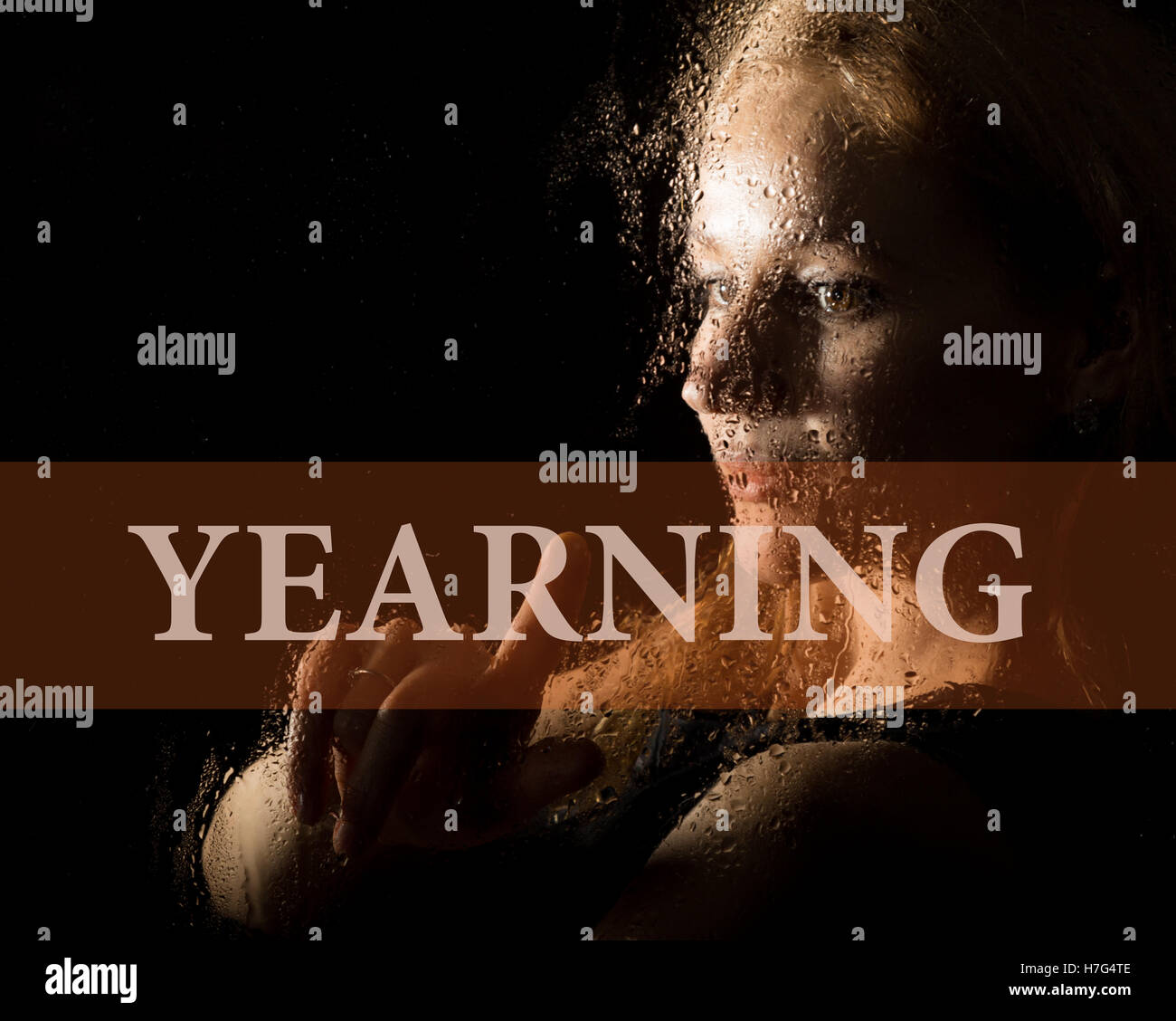 yearning written on virtual screen. hand of young woman melancholy and ...