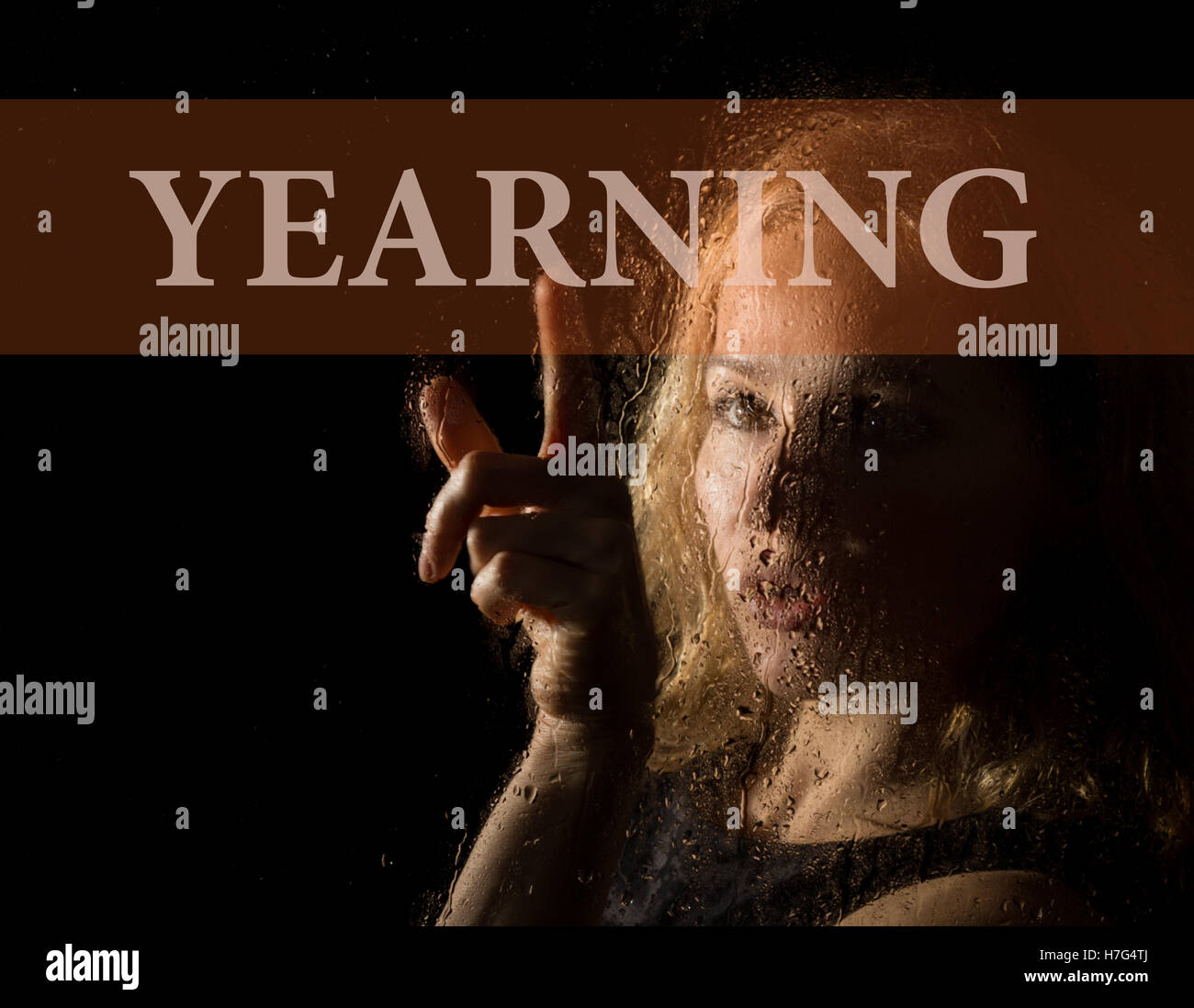 yearning written on virtual screen. hand of young woman melancholy and ...