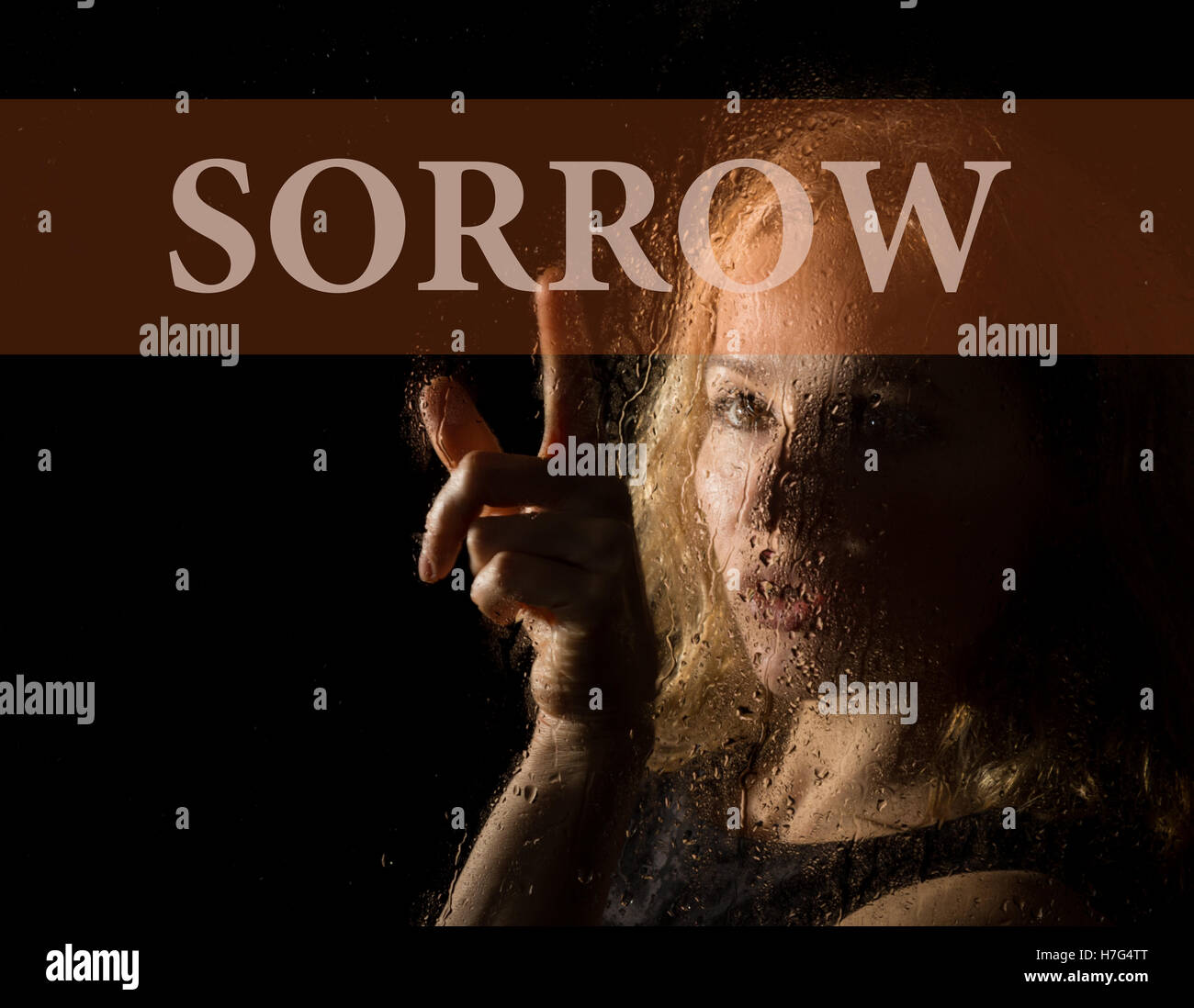 sorrow written on virtual screen. hand of young woman melancholy and ...