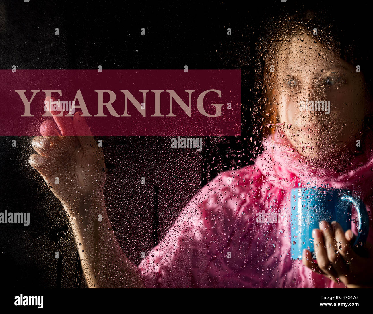 yearning written on virtual screen. young woman melancholy and sad at ...